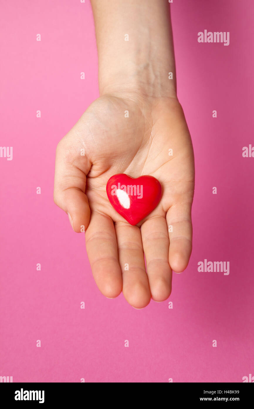 Hand offering heart symbol hi-res stock photography and images - Alamy