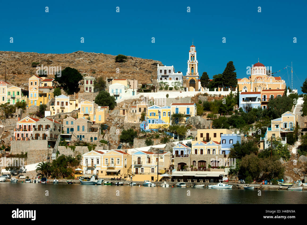 Greece, Symi, churches in the harbour place Gialos Stock Photo - Alamy