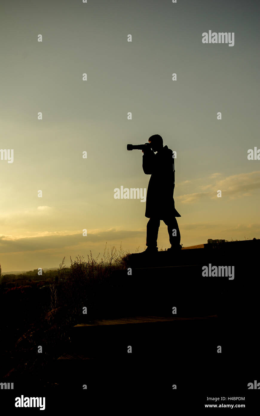 Photographer with his camera in open air Stock Photo - Alamy