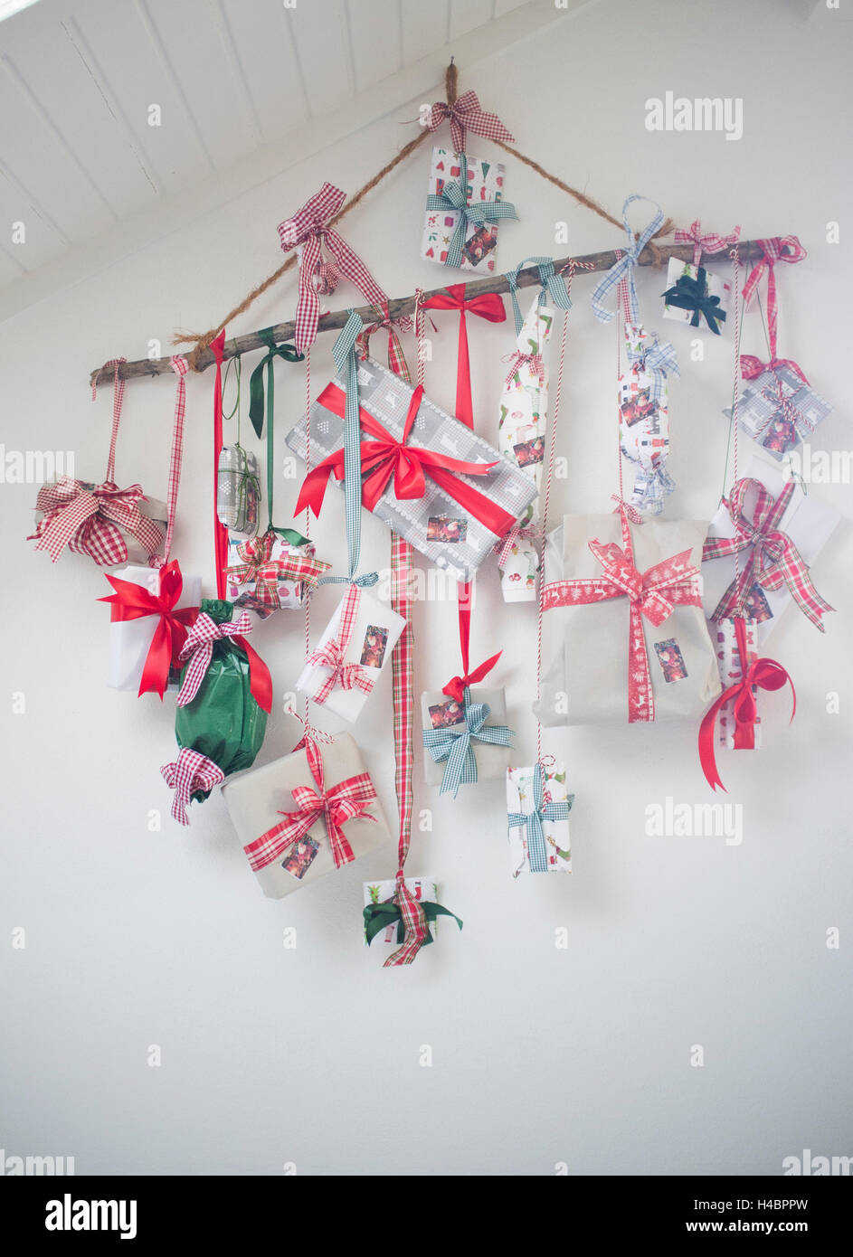 Advent calendar with packet in front of white wall Stock Photo - Alamy