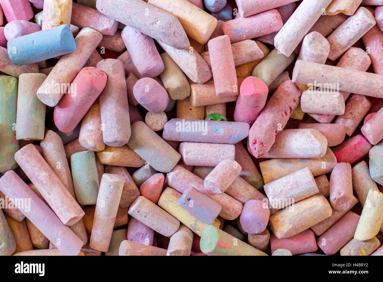 Different colors of soft-prepared chalks isolated, used on a blackboard ...