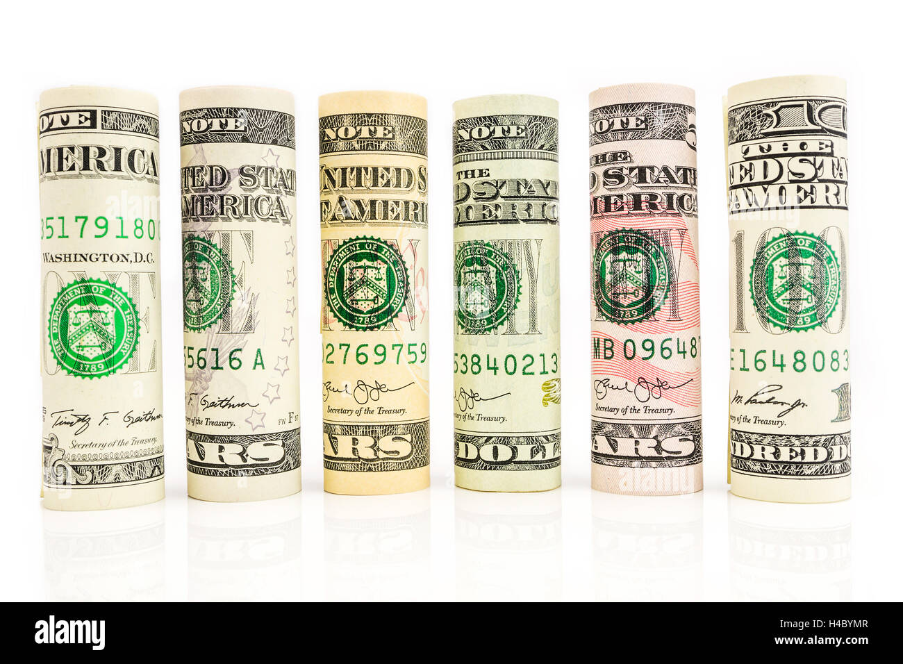 american dollar banknote rolls in all denominations in one row on white ...
