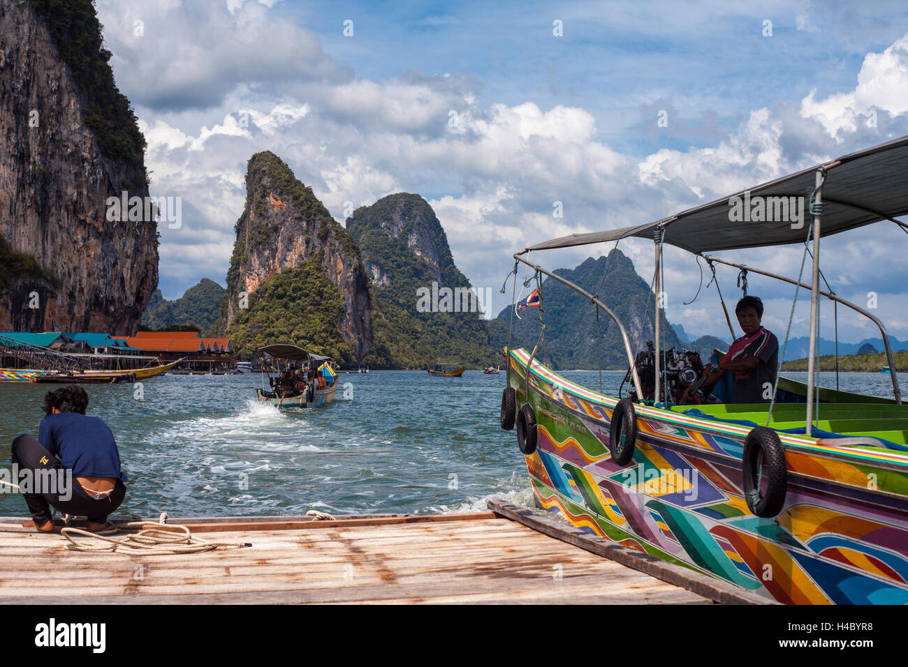 PHUKET, THAILAND, on 11 NOVEMBER, Long boat and rocks in the Gulf of ...