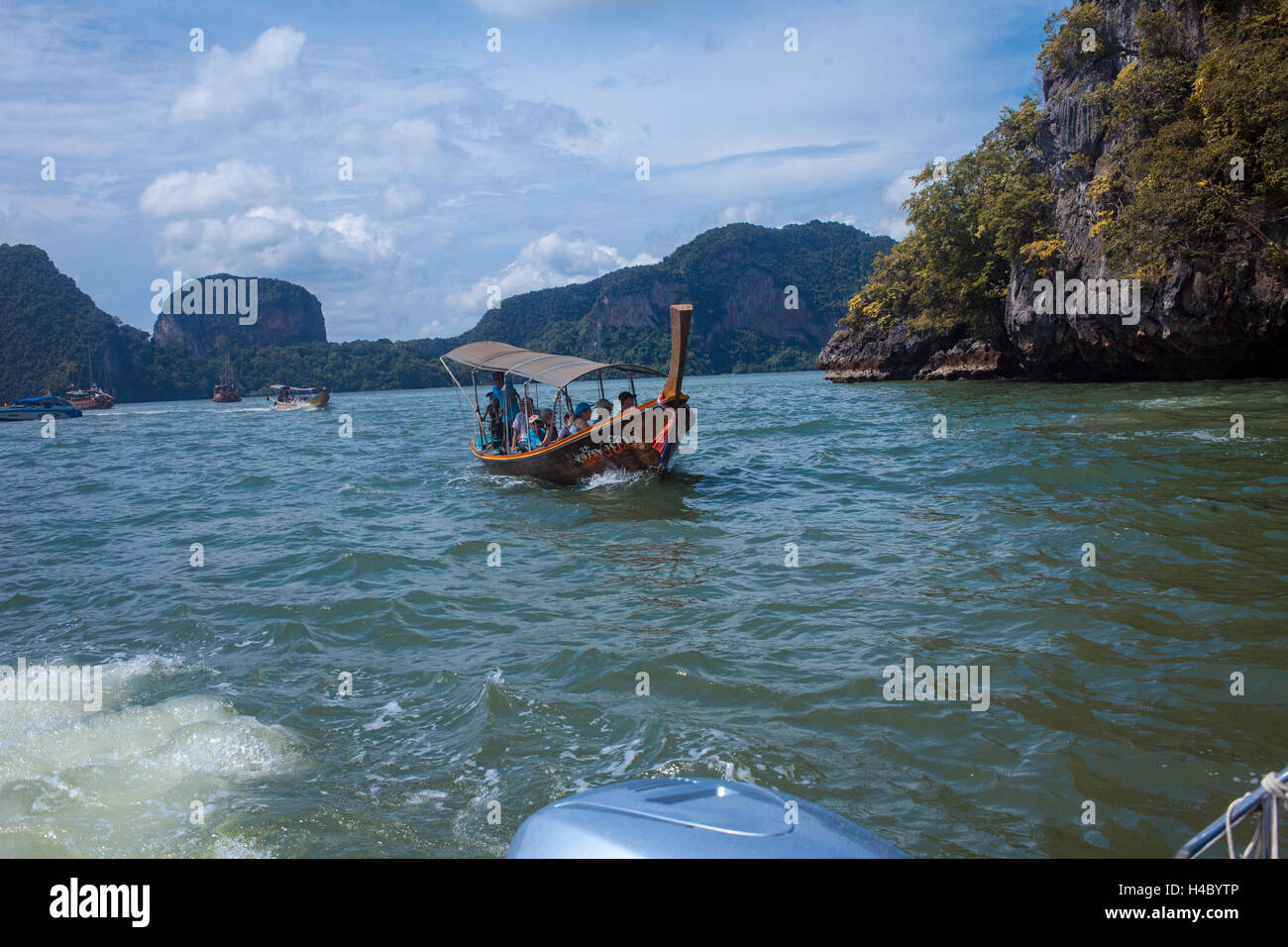 PHUKET, THAILAND, on 11 NOVEMBER, Long boat and rocks in the Gulf of ...