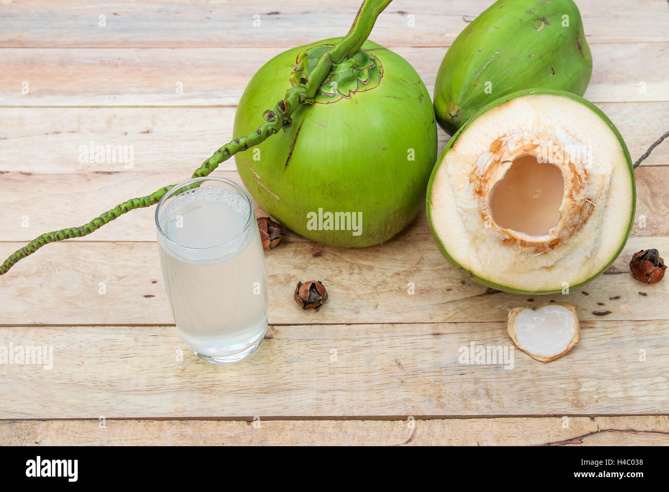 Fresh Coconut Water Drink in glass with coconut leaf on wooden ...