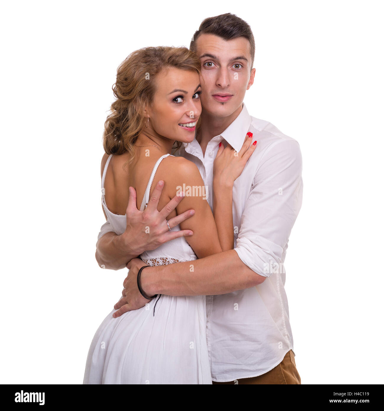 Cheerful young couple on white background, isolated Stock Photo - Alamy