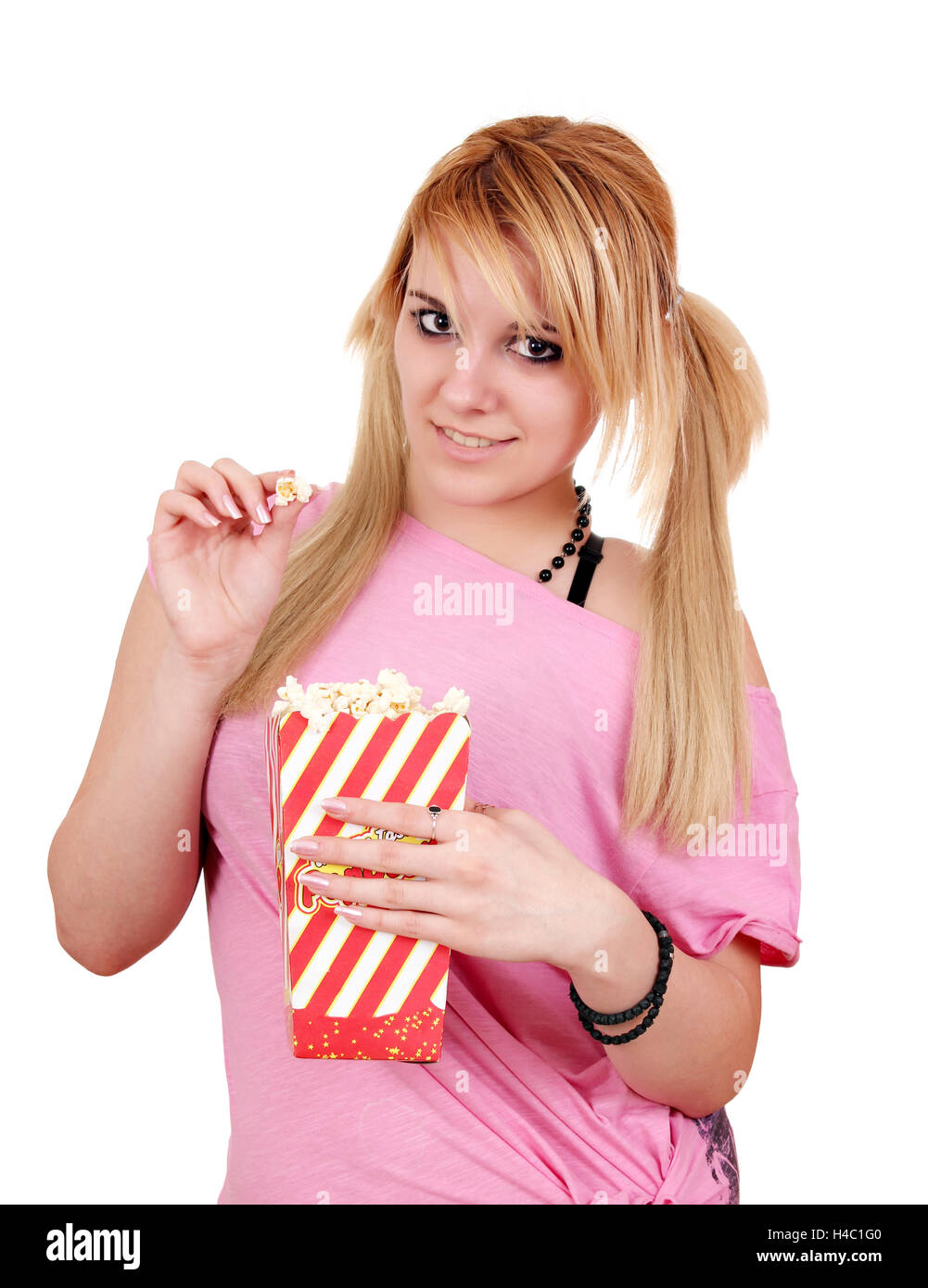 Pretty smiling girl eating popcorn hi-res stock photography and images ...