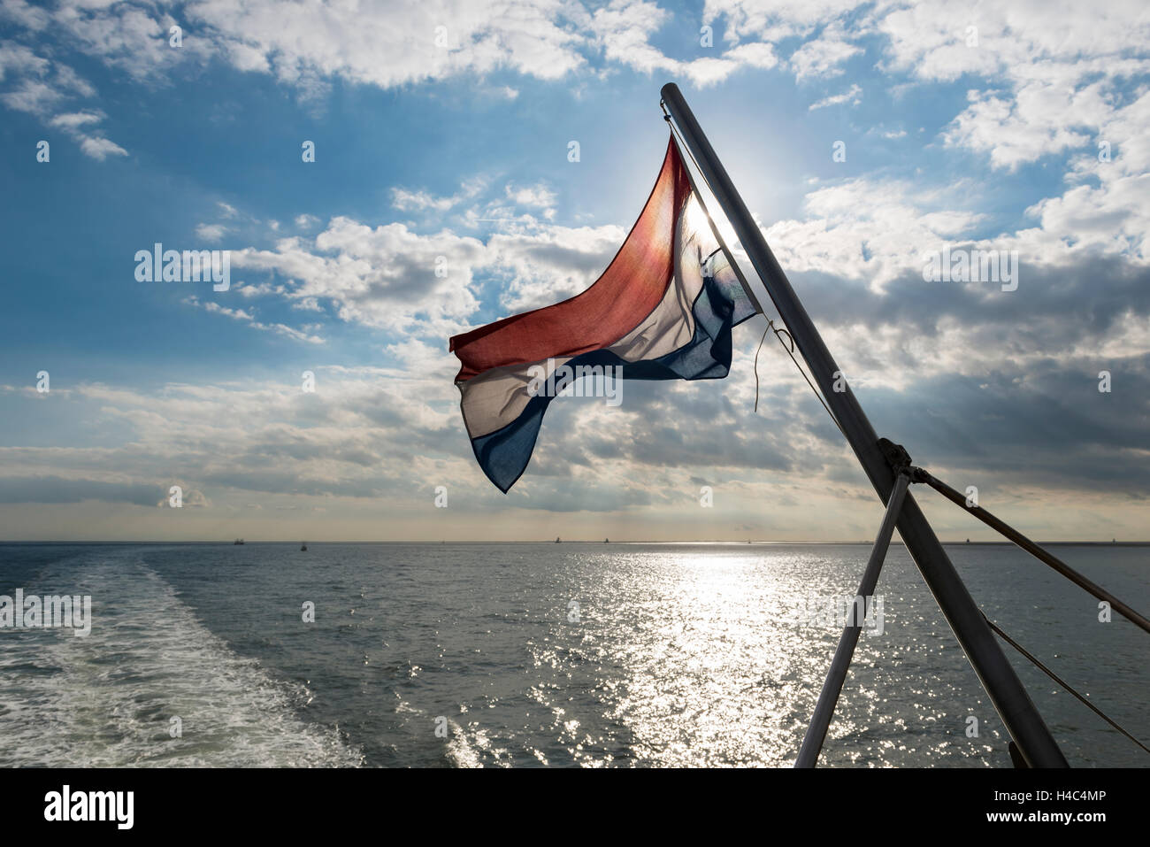 Wadden Sea with Dutch flag as seen from the ferry Stock Photo - Alamy