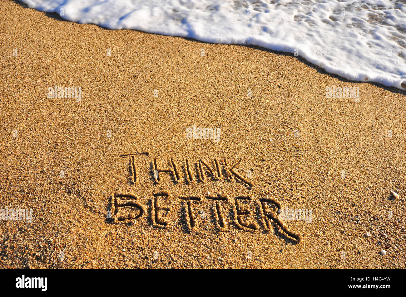 Think better sign on the sand beach Stock Photo - Alamy