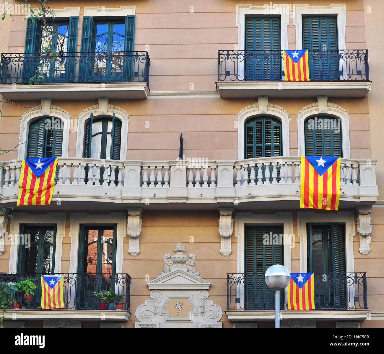 Houses of Barcelona with flags of Catalonia Stock Photo - Alamy