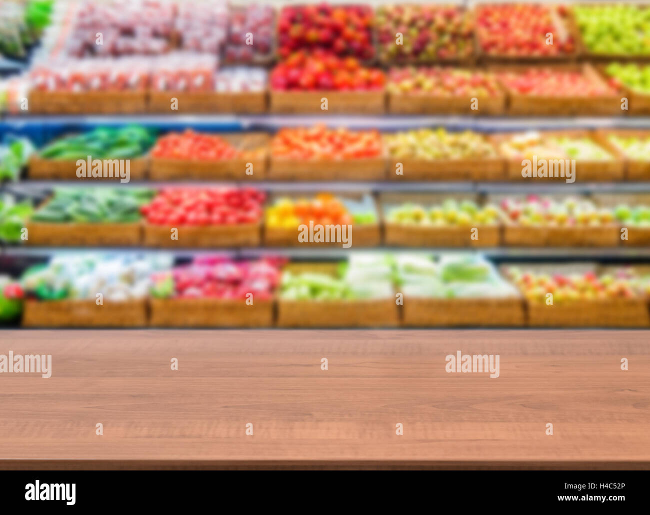 Wooden empty table in front of blurred supermarket fruits shelf Stock ...