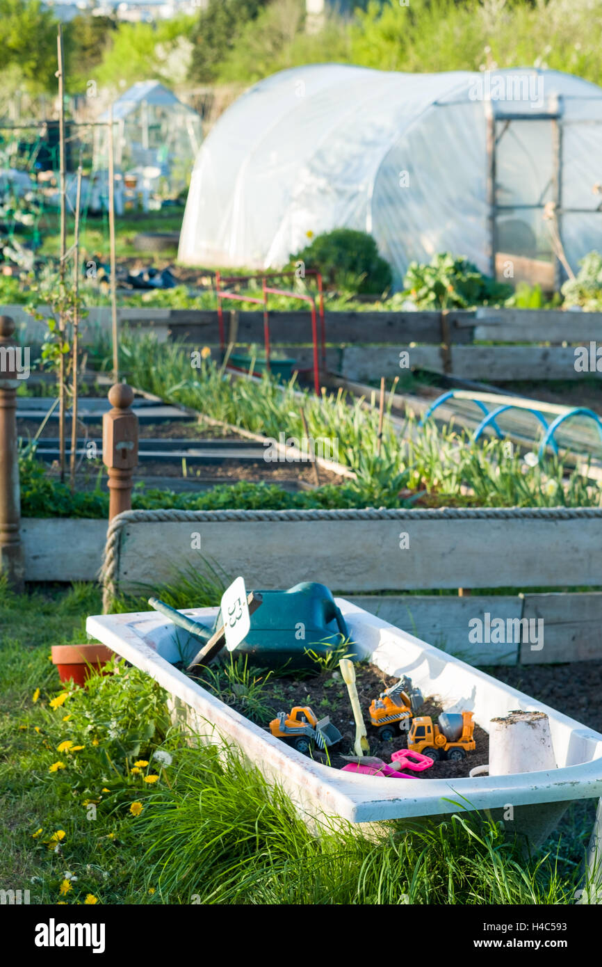 Children's play things on allotment Stock Photo - Alamy