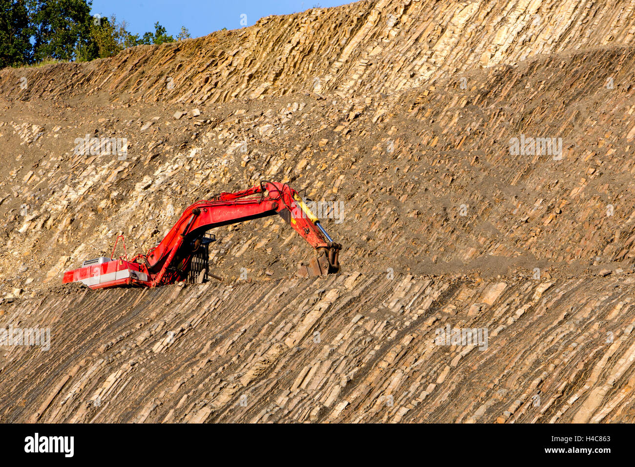 Red digger in stone-pit Stock Photo - Alamy