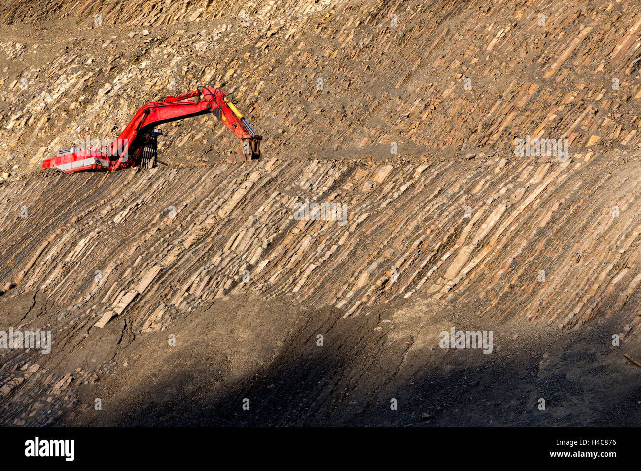 Red digger in stone-pit Stock Photo - Alamy