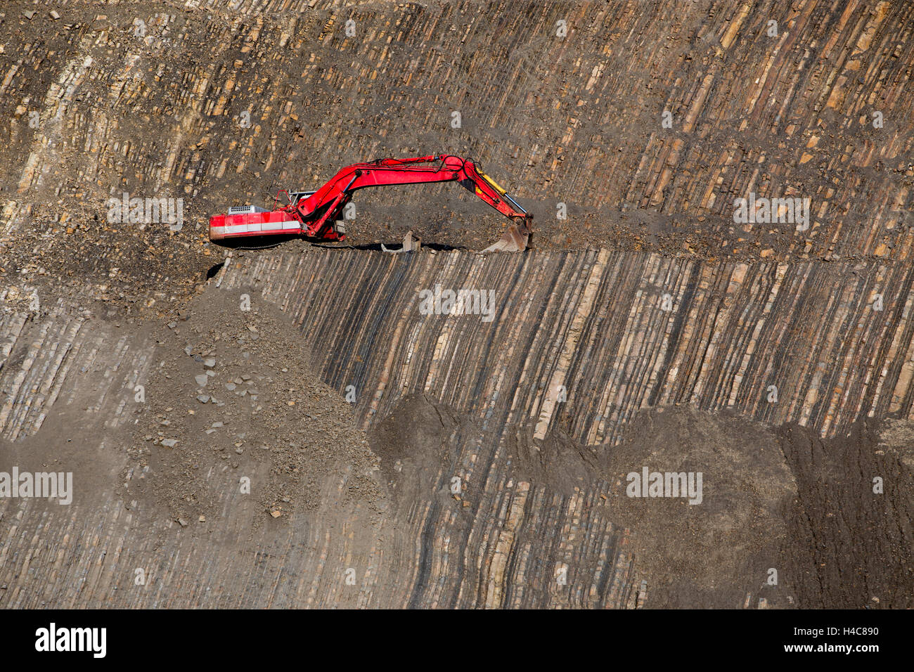Red digger in stone-pit Stock Photo - Alamy