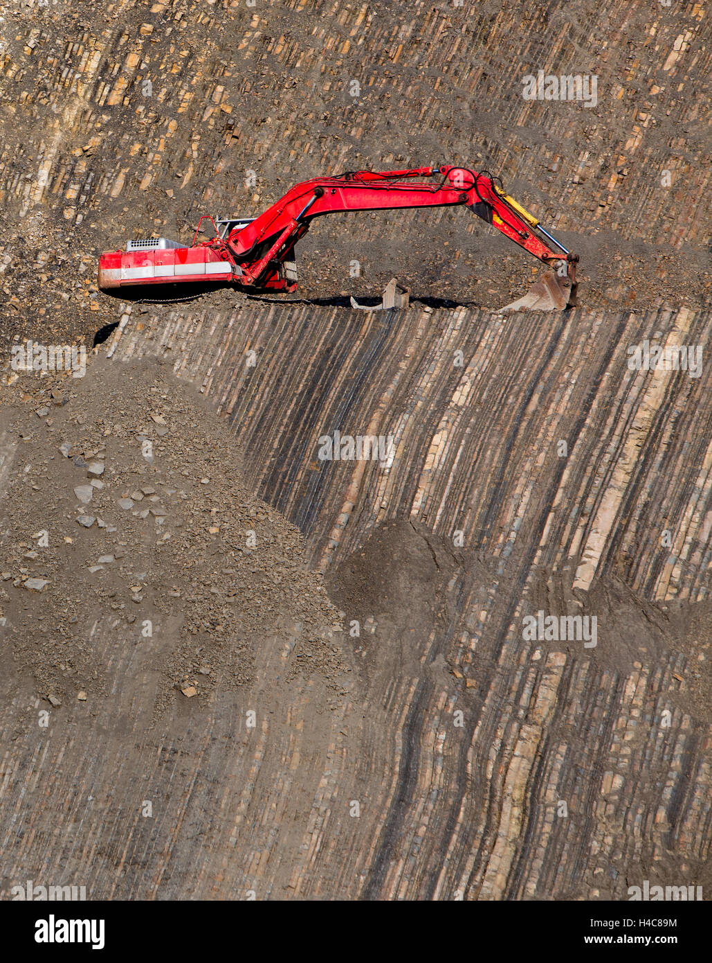 Red digger in stone-pit Stock Photo - Alamy