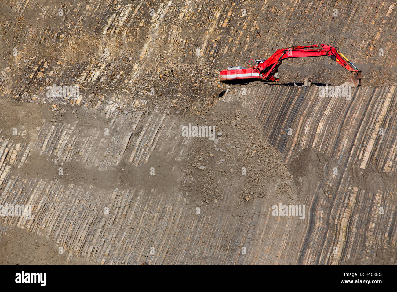 Red digger in stone-pit Stock Photo - Alamy