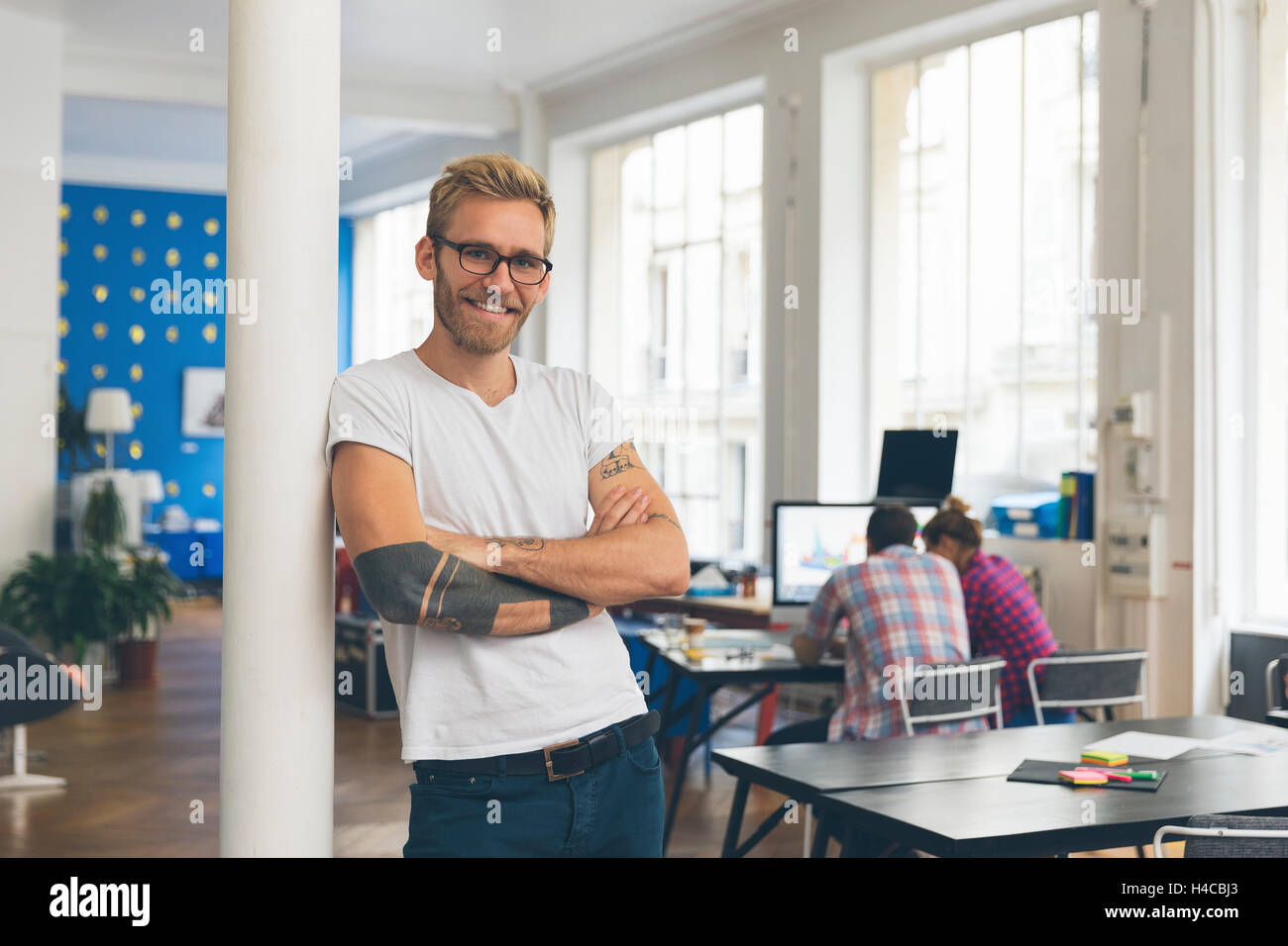 Portrait of a handsome designer in the office Stock Photo - Alamy