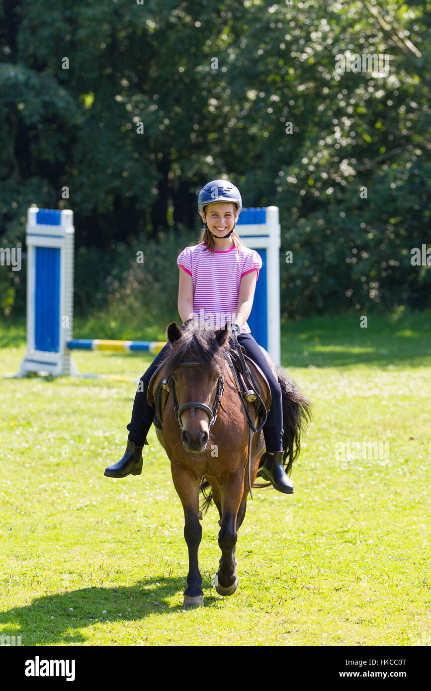 Child on a pony Stock Photo - Alamy
