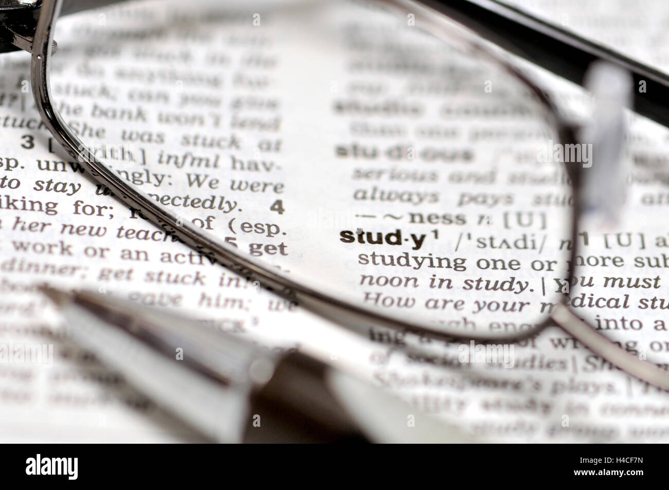 'Study' concept - dictionary, glasses and pen Stock Photo - Alamy