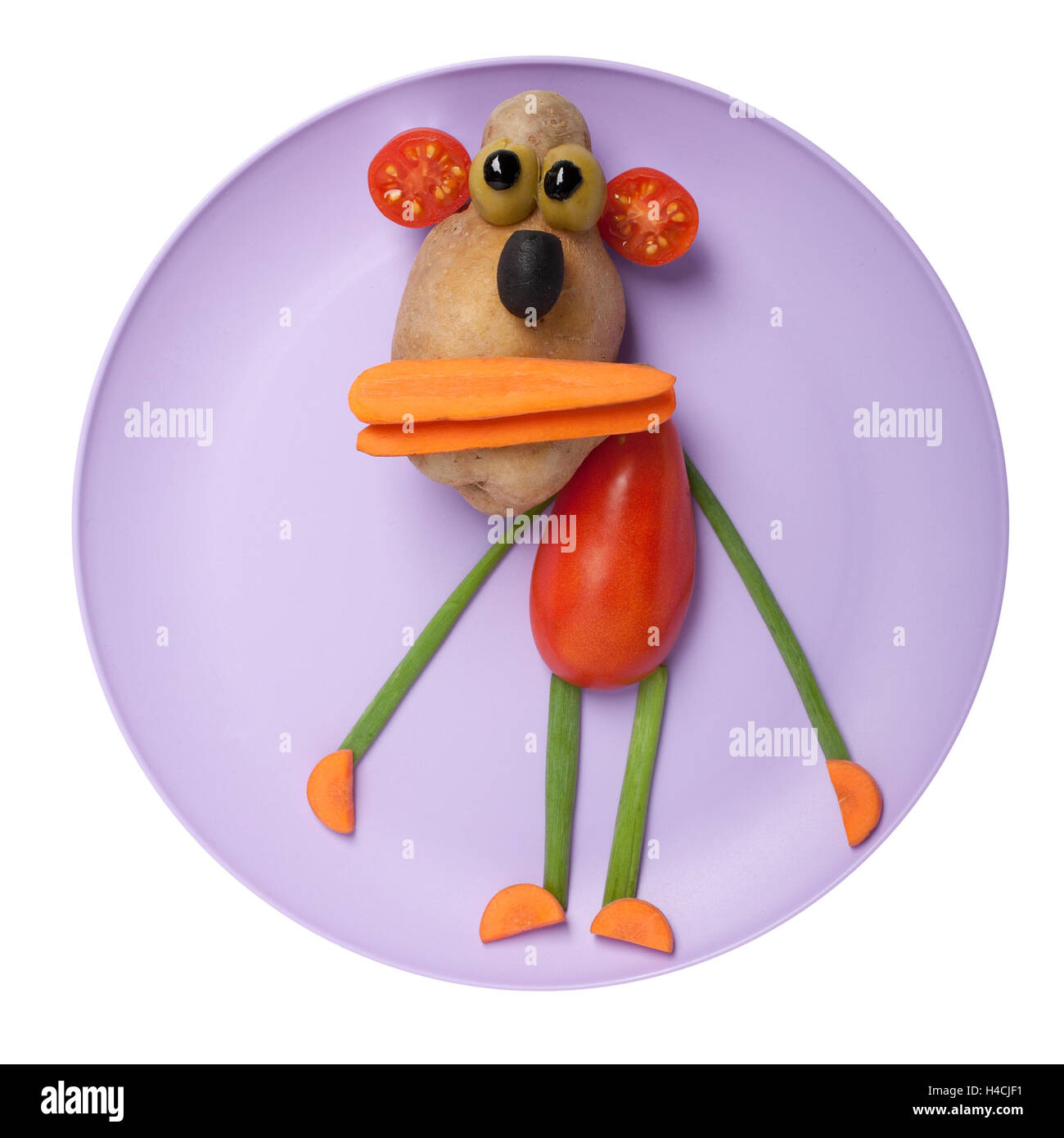 Monkey made of vegetables on purple plate Stock Photo - Alamy