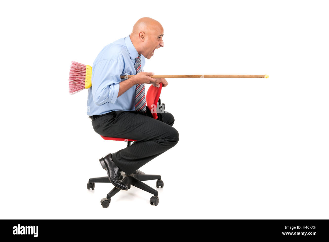 worker in a chair jousting with a broom Stock Photo - Alamy