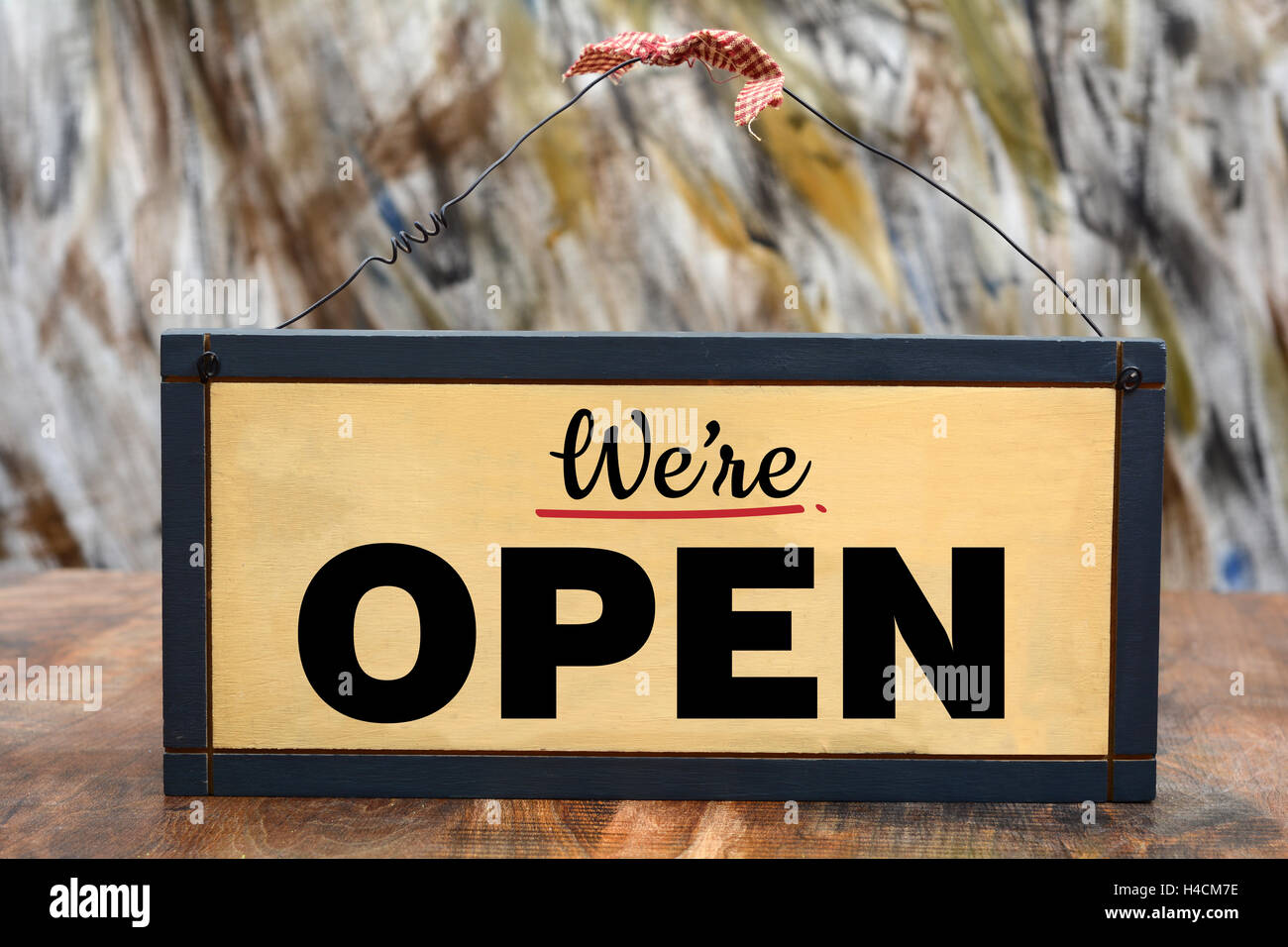We're Open Shop Sign on Wood Frame Stock Photo - Alamy