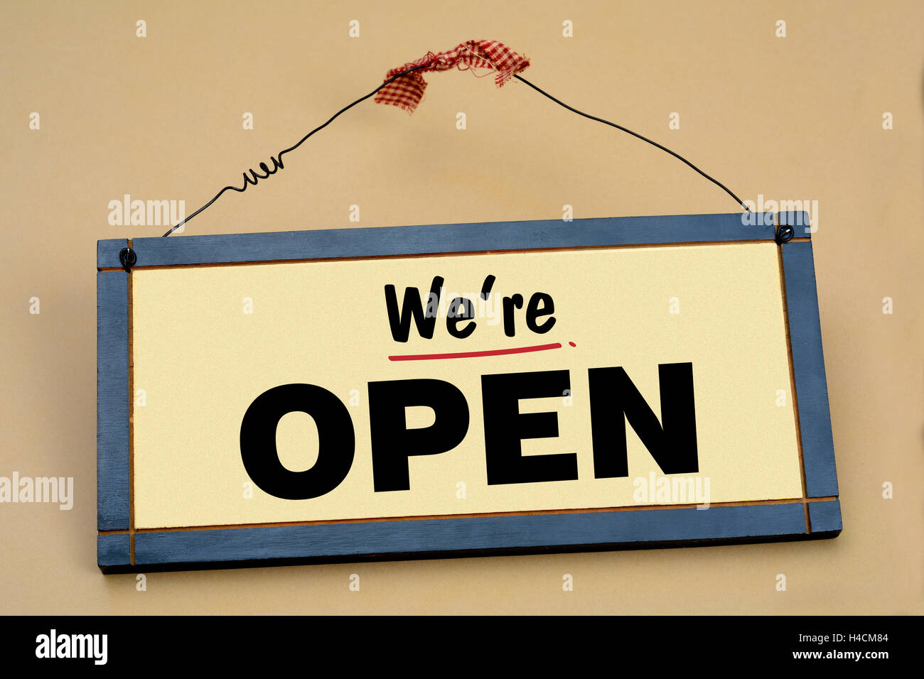 We're Open Shop Sign on Wood Frame Stock Photo - Alamy