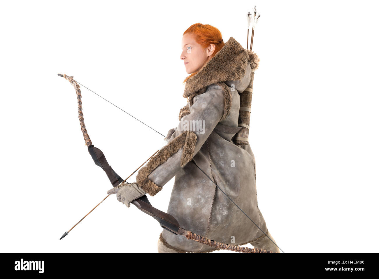 girl archer in a costume with bow isolated in white Stock Photo - Alamy