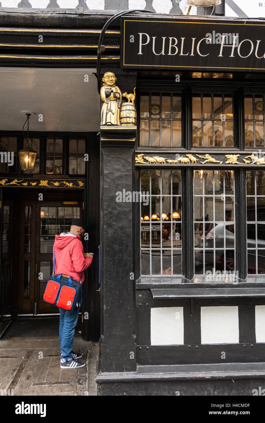 Wood carving of a monk on The George public house on the Strand, London ...