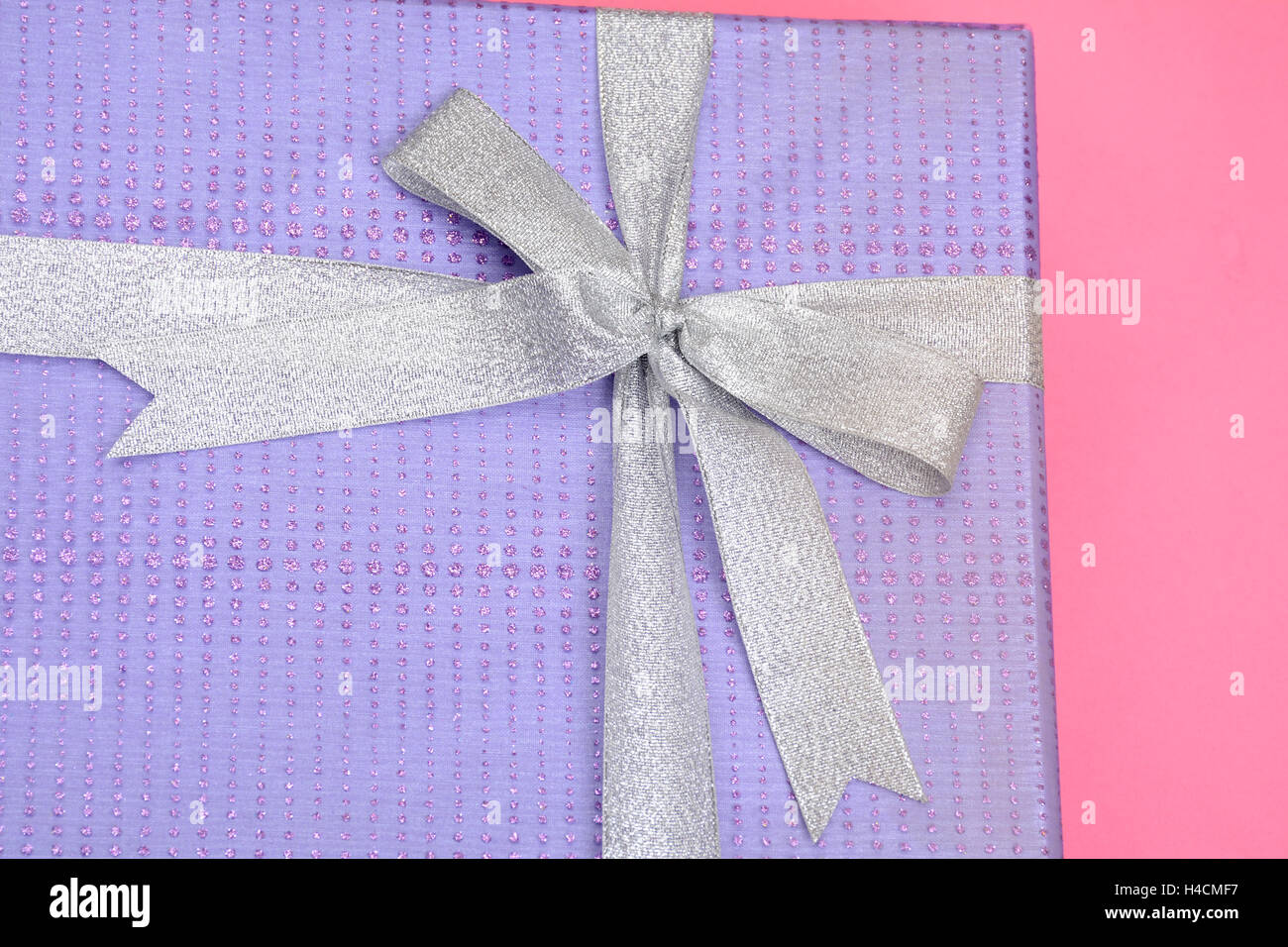 Gift Box with Silver Ribbon and bow close up Stock Photo - Alamy