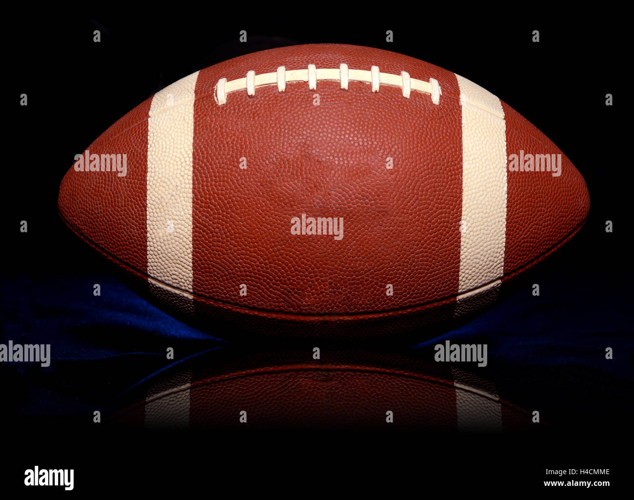 American Football close up with reflection on black background Stock ...
