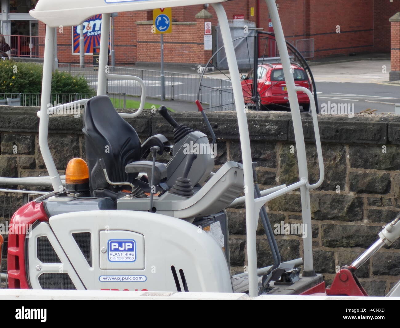 The cockpit of a digger Stock Photo - Alamy