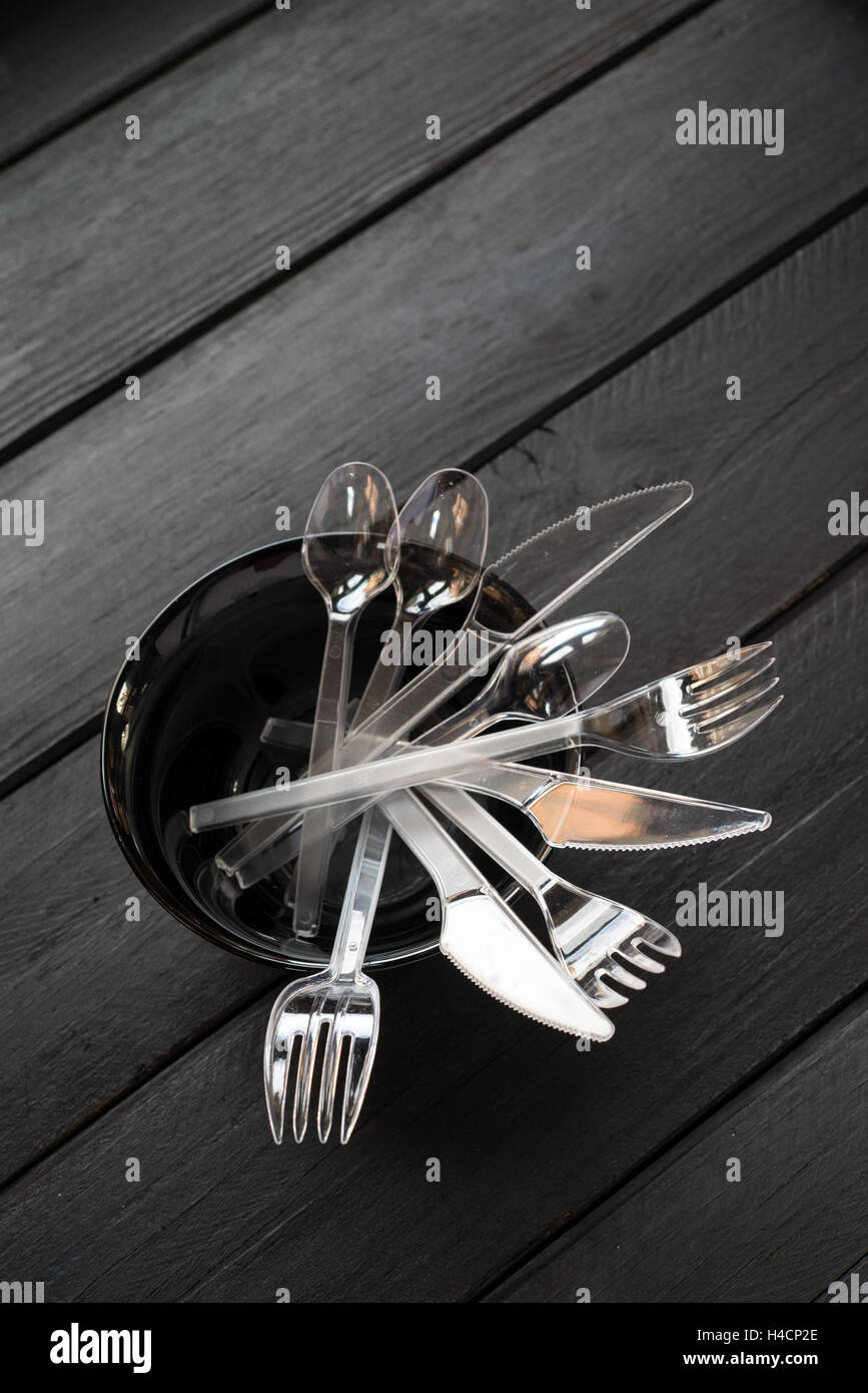 transparent plastic cutlery on black background Stock Photo - Alamy