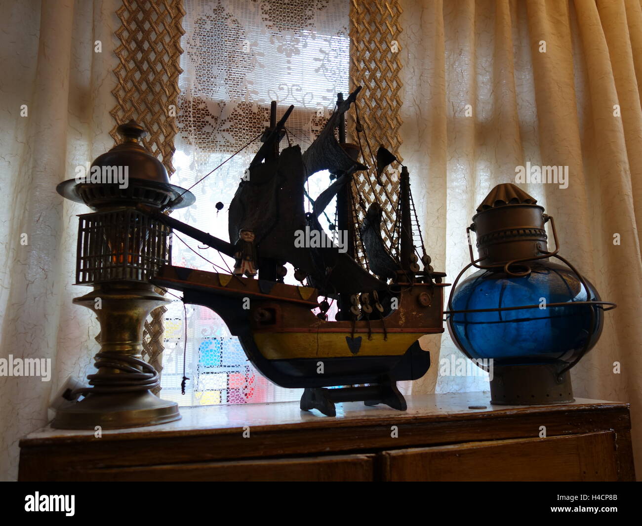 An old model ship and nautical lamps Stock Photo - Alamy