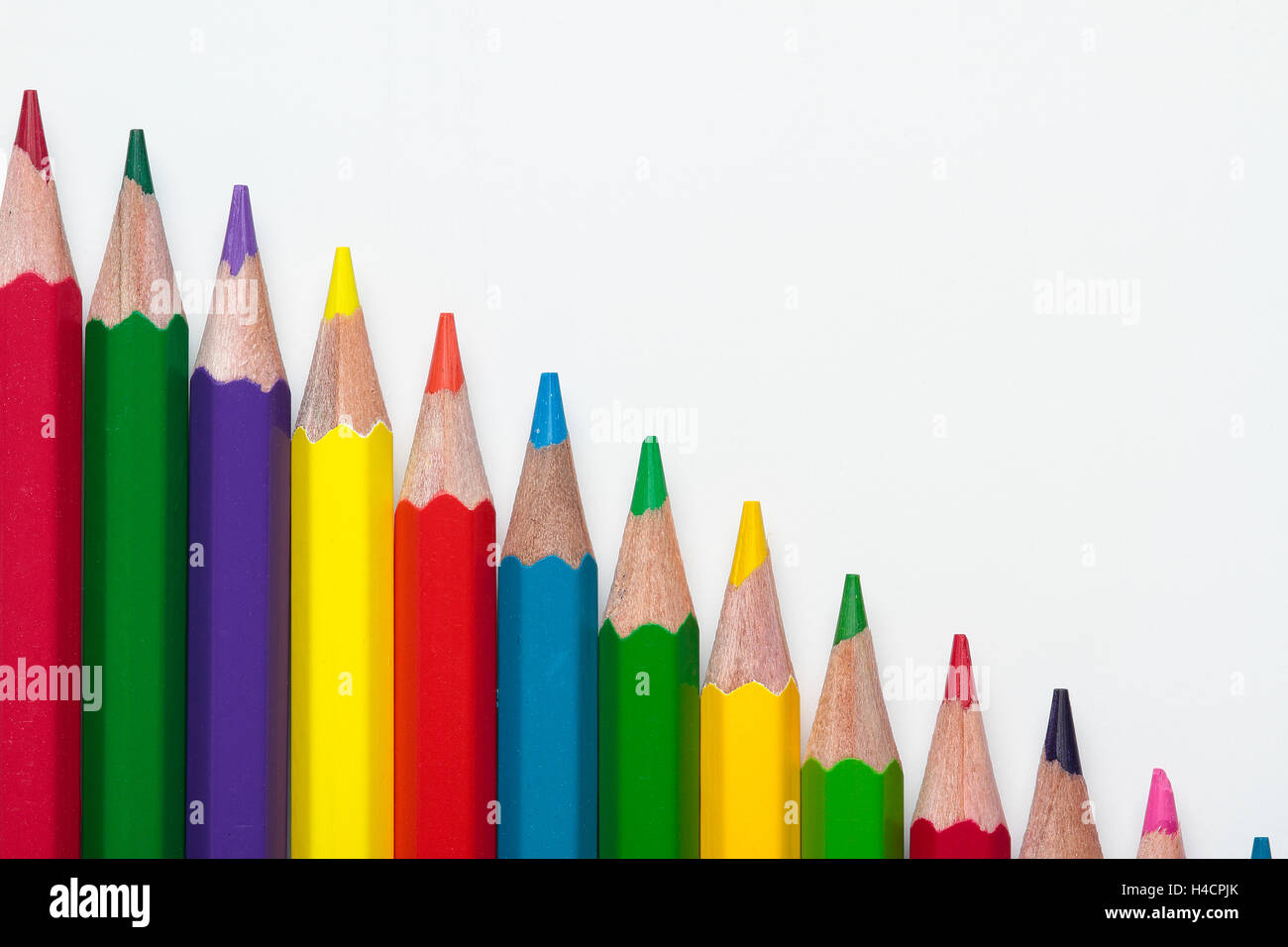 row of crayons on white background Stock Photo - Alamy