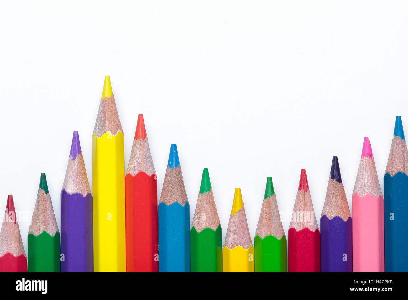 row of crayons on white background Stock Photo - Alamy