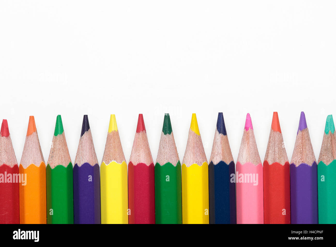row of crayons on white background Stock Photo - Alamy