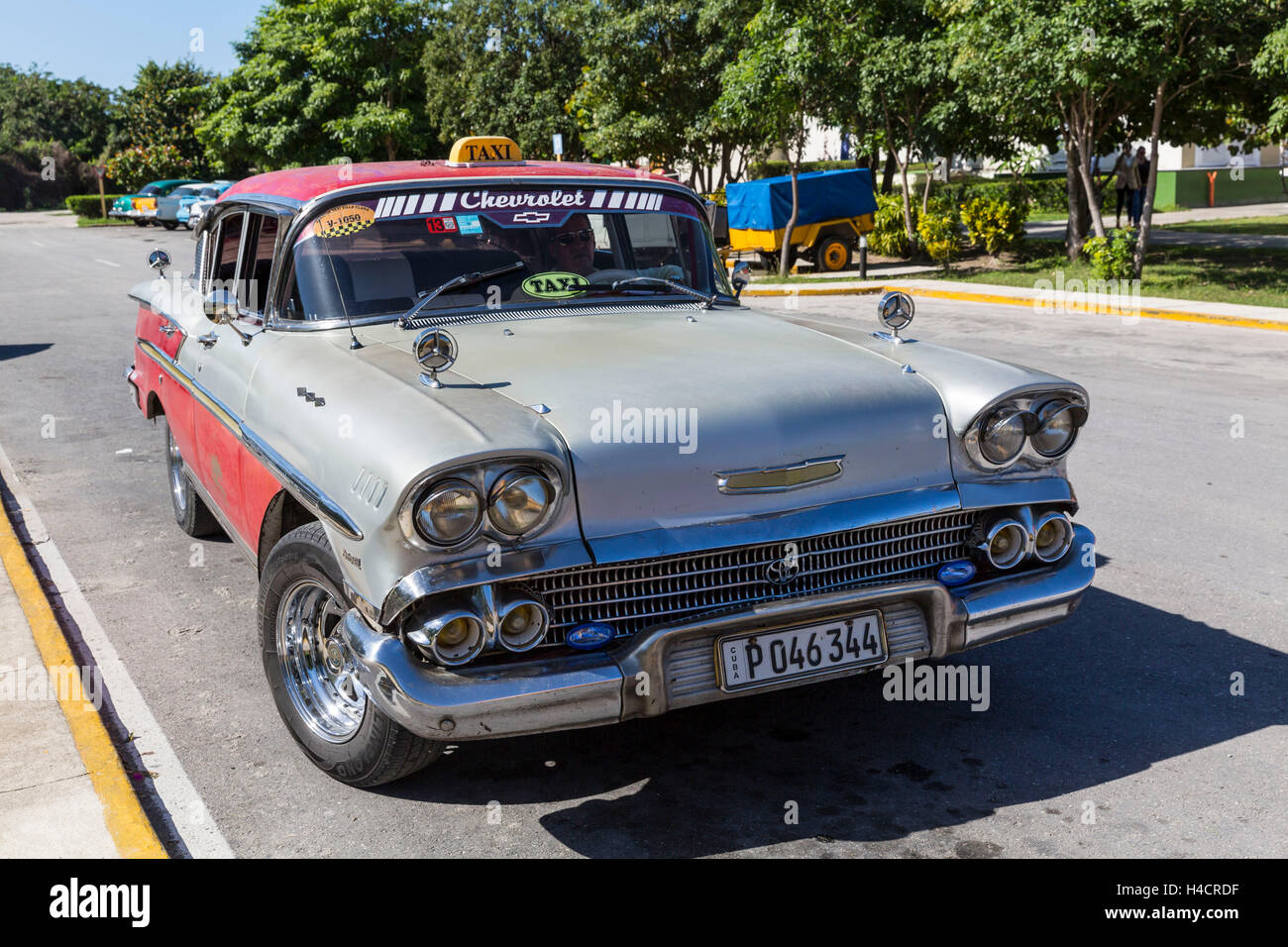 Old-timer taxi in front of the Pueblo La Estrella Village ...