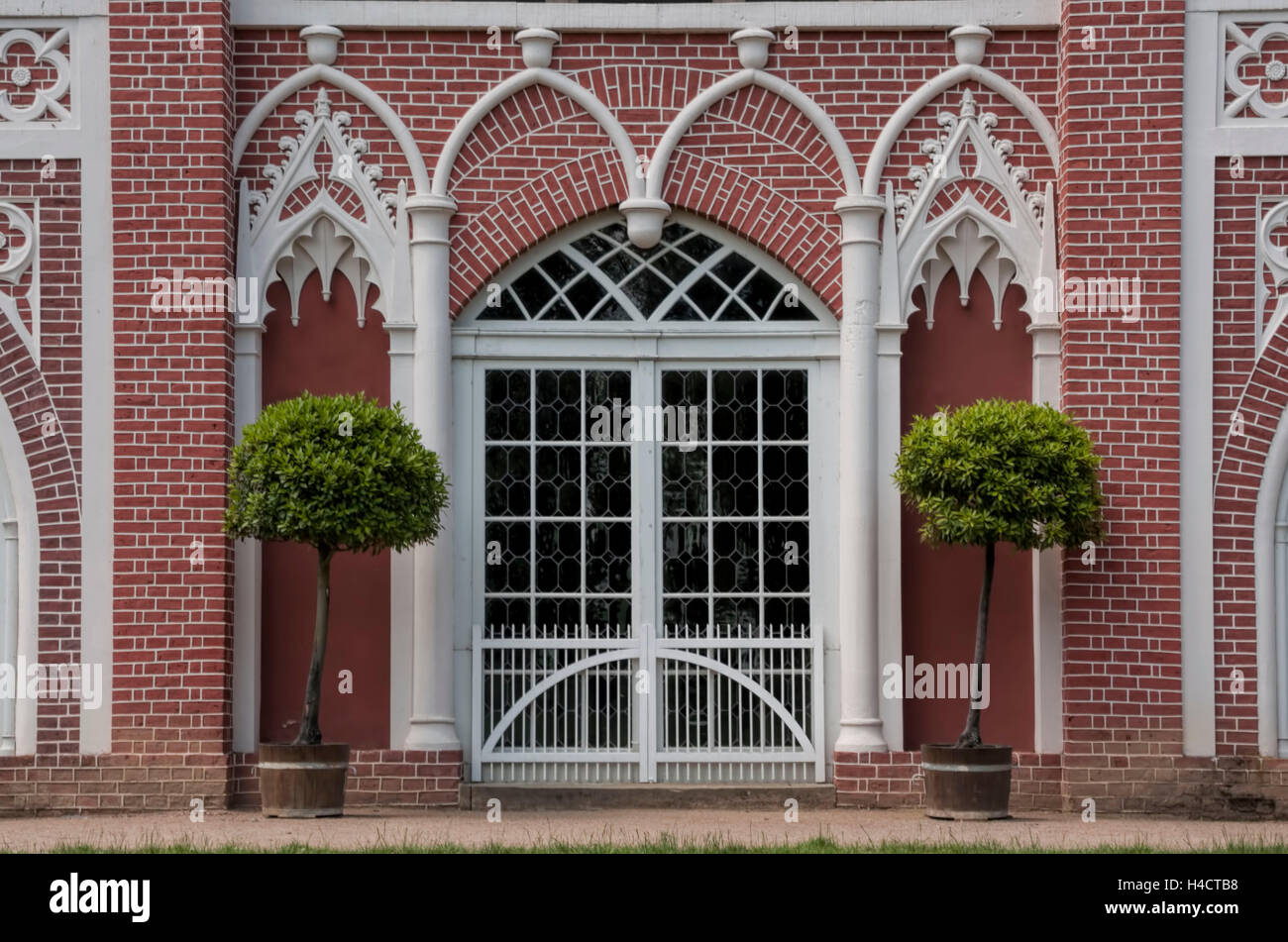 WÃ¶rlitzer park, Gothic house, brick building, entrance, two trees in ...