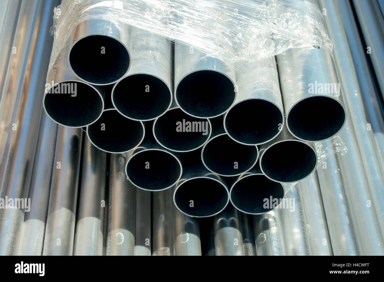 Stack of Many Pipes at the Construction Site Stock Photo - Alamy