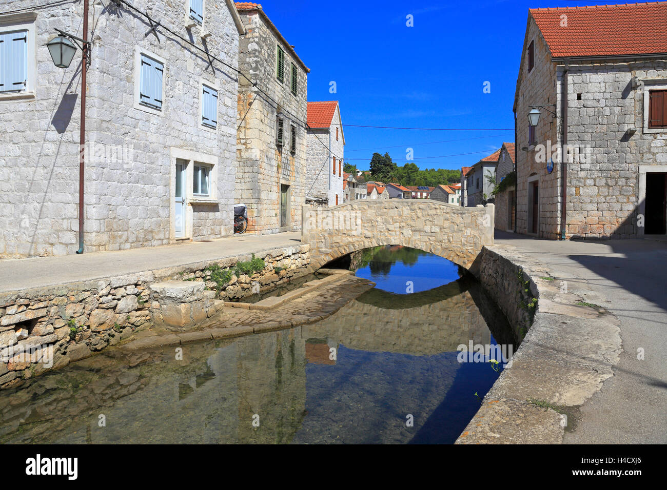 Small stone bridge over the canal, Vrboska, Hvar Island, Croatia ...