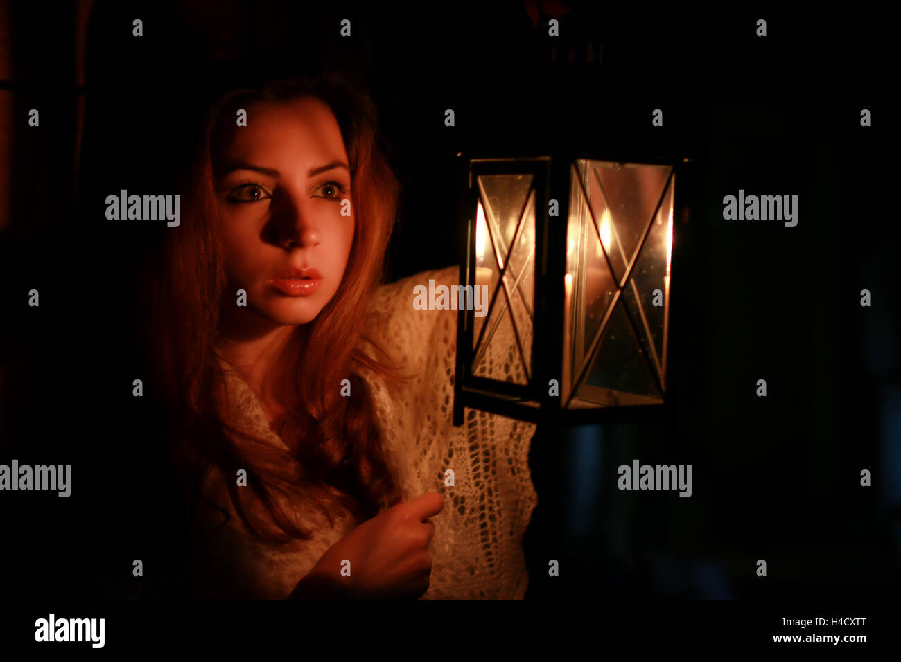 woman candle lamp dark night Stock Photo - Alamy