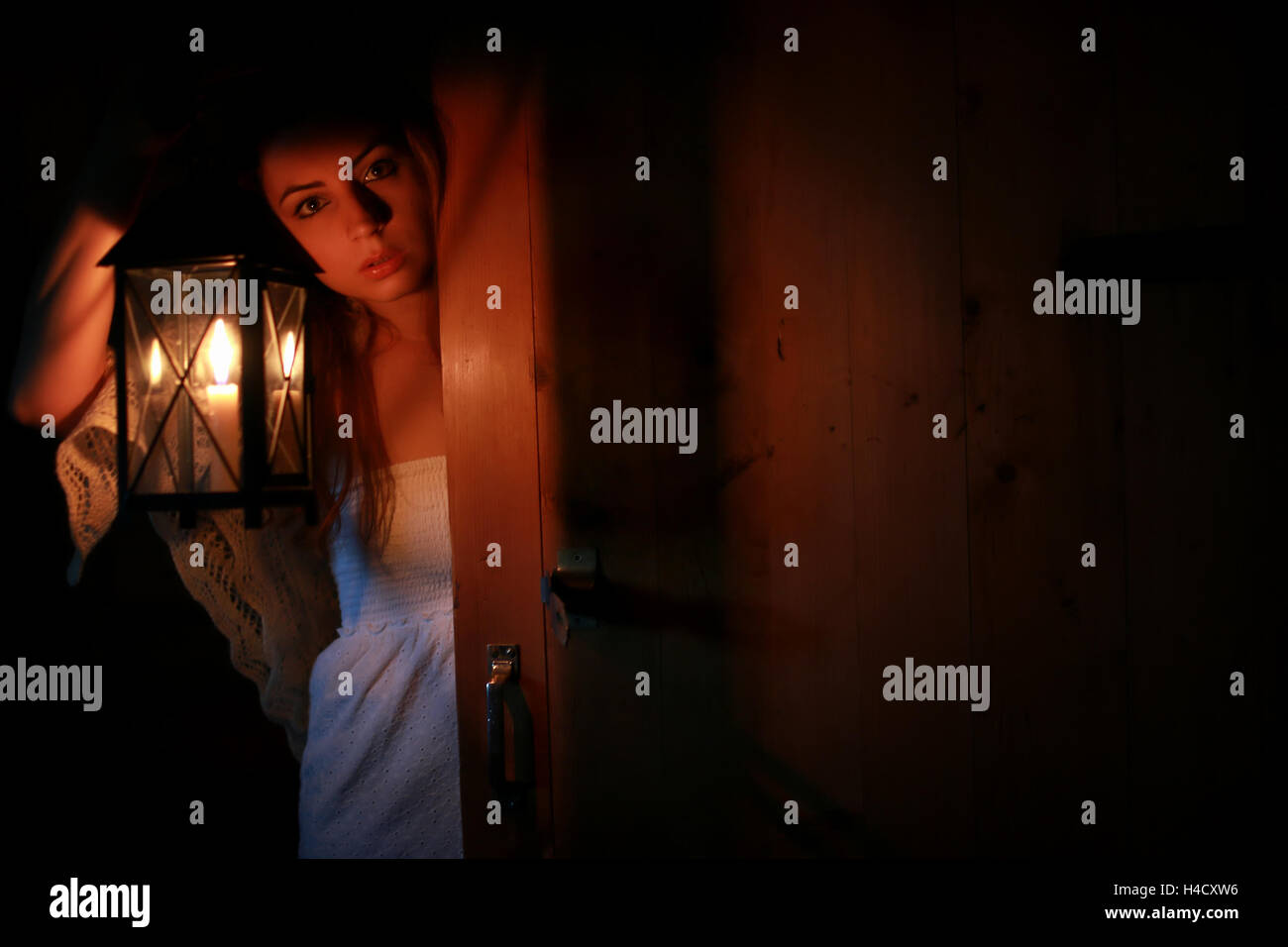woman candle lamp dark night Stock Photo - Alamy