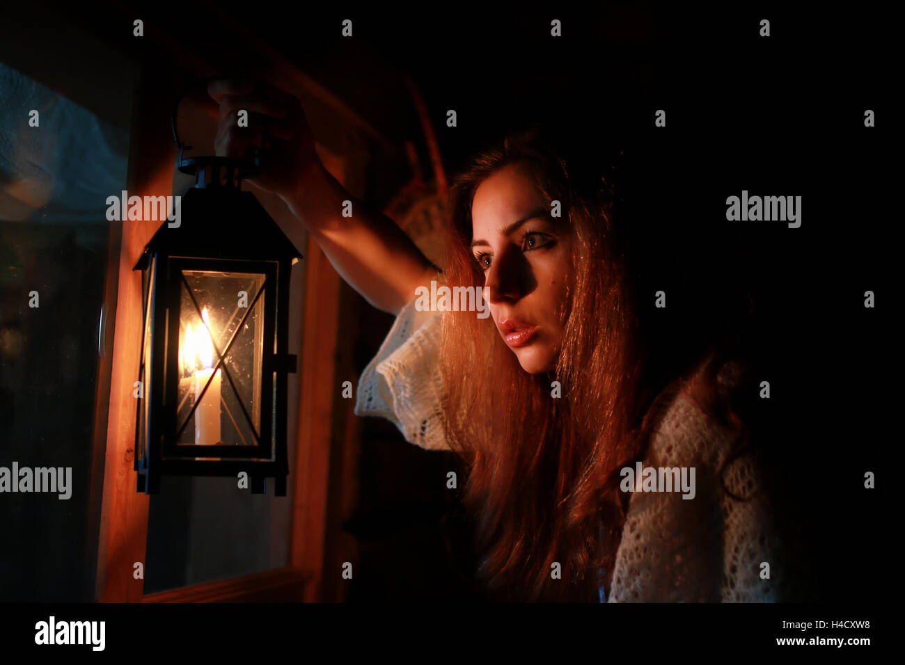 woman candle lamp dark night Stock Photo - Alamy