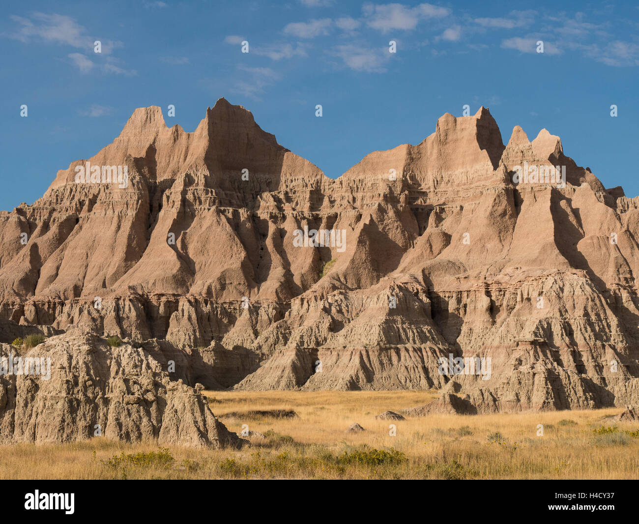 Late afternoon light on formations and peaks, Badlands Loop Road scenic ...