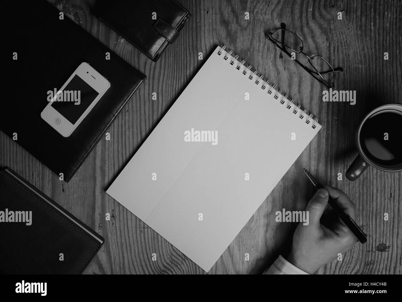 Hand pen papers Black and White Stock Photos & Images - Alamy