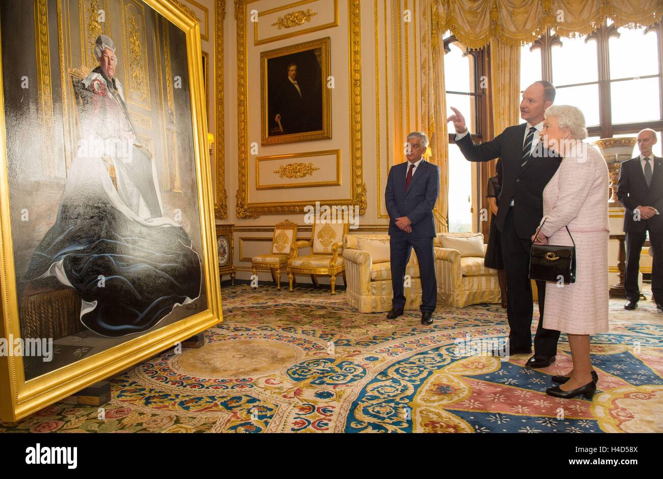 British artist Henry Ward shows Queen Elizabeth II his portrait of her ...