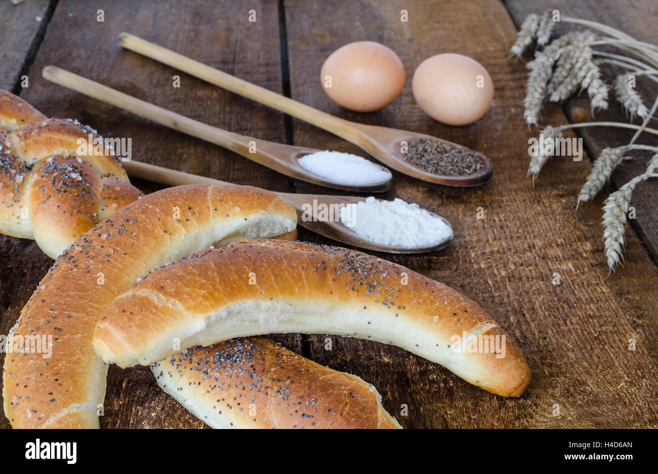 Roll, pastry from home bakery on wood table with wheat Stock Photo - Alamy