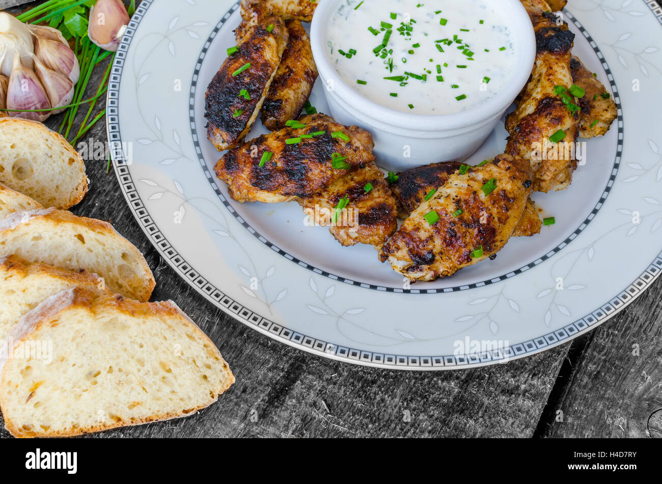 Grilled chicken wings, fresh bread, home garlic and chive with cheese ...